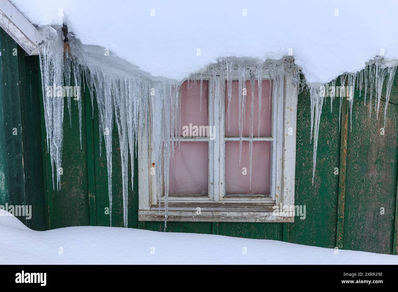 Snow covered typical greenlandic house in winter, deep snow, Tasiilaq ...