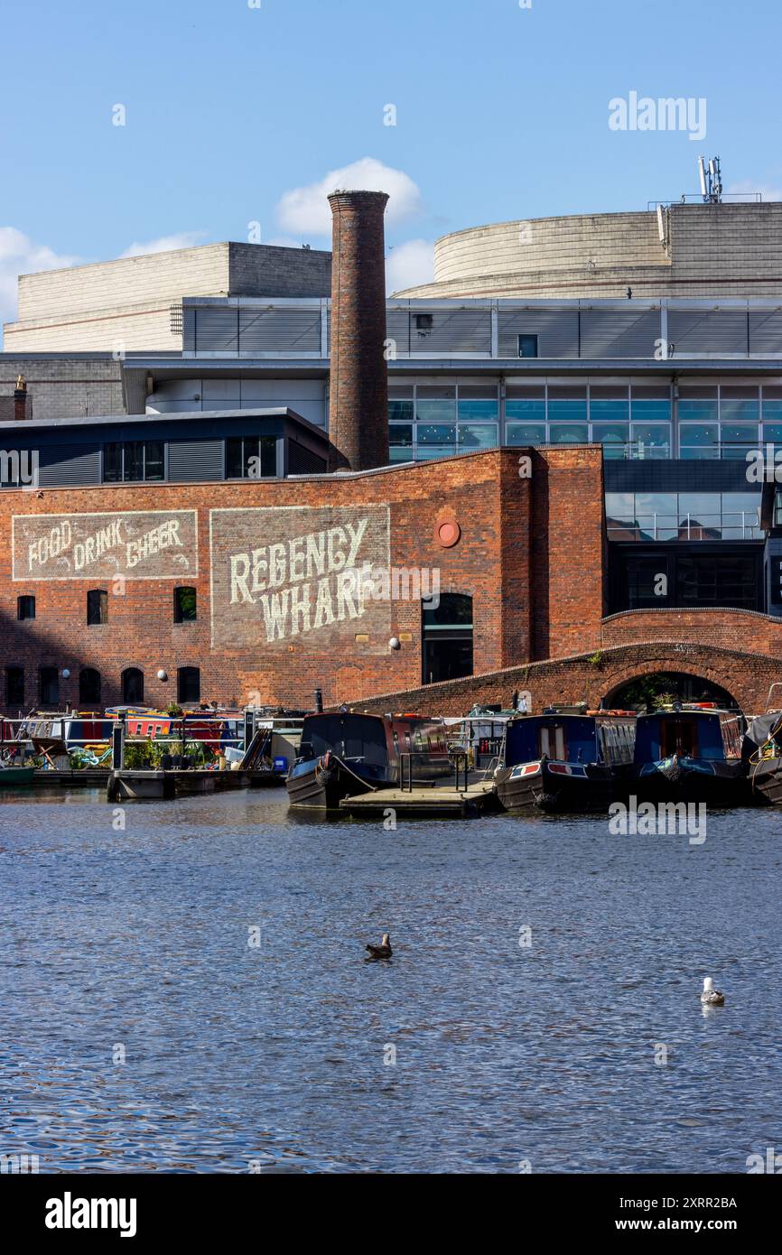 Canal boats and brick buildings in the historic Regency Wharf area on ...