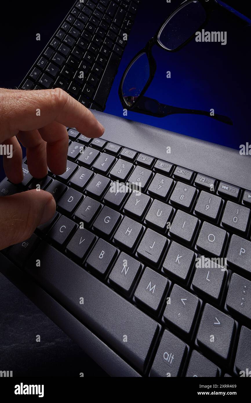 Typing away on computer keyboards Stock Photo - Alamy
