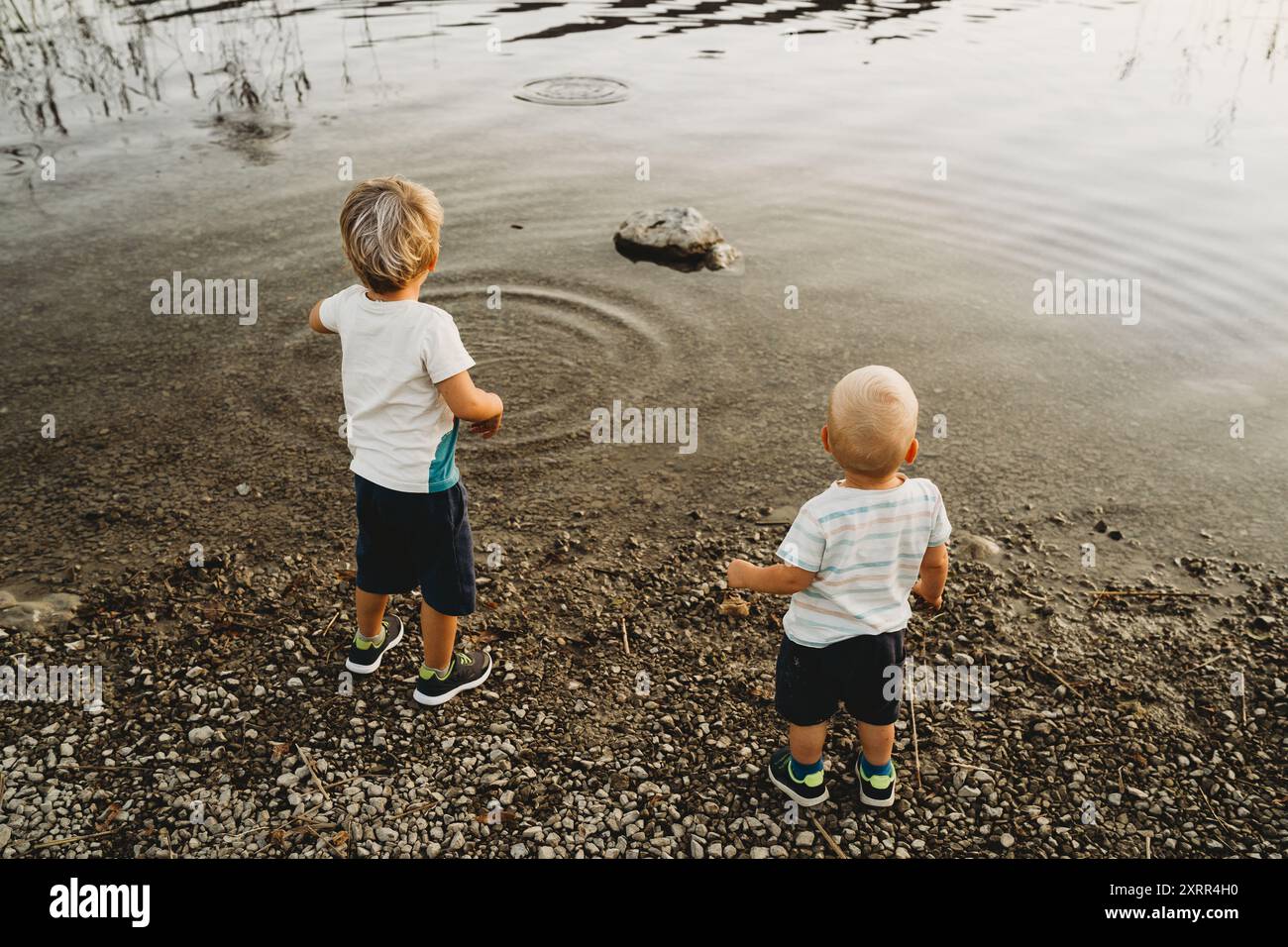 Child skipping stones hi-res stock photography and images - Alamy