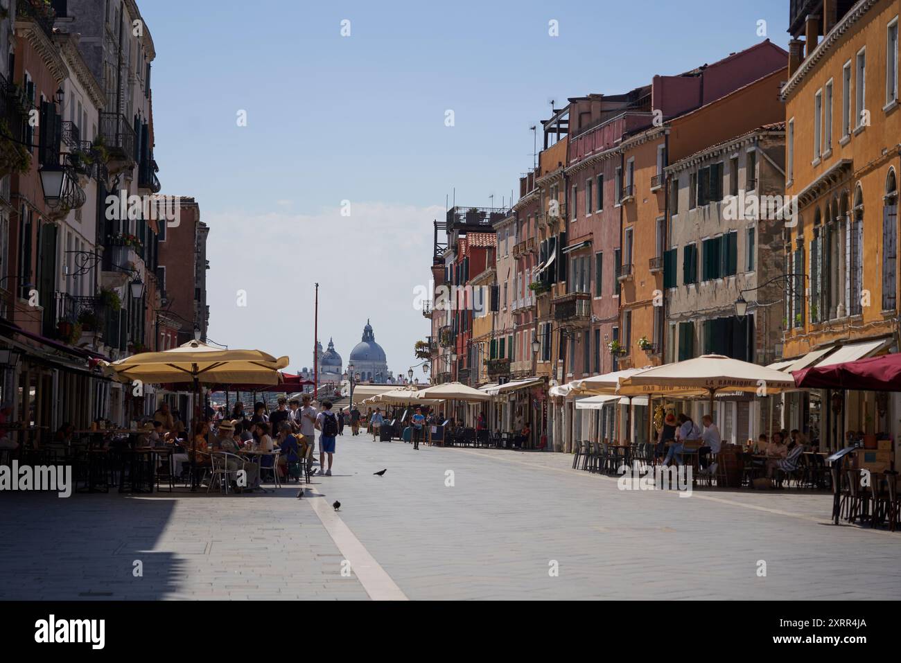 Sunny Venetian Street with Bustling Cafes and Basilica View Stock Photo ...