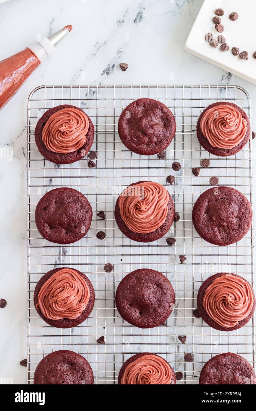 Beetroot chocolate cupcakes on cooling rack with frosting Stock Photo ...