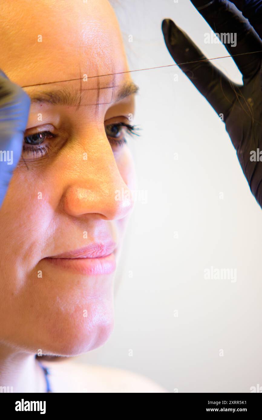 Eyebrow Threading Preparation for micro blading treatment Stock Photo ...