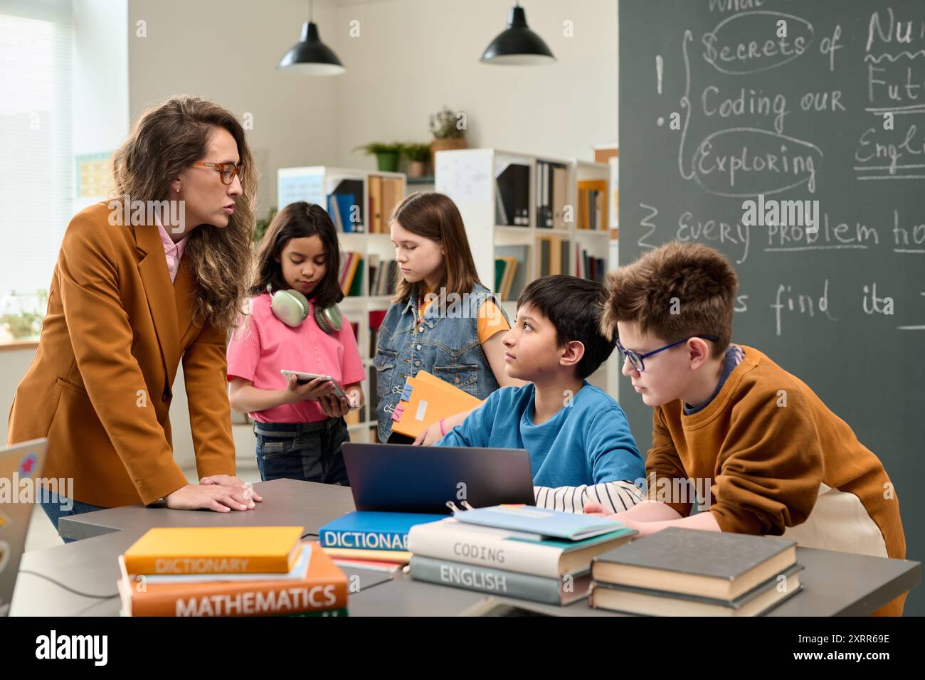 Female teacher group kids using hi-res stock photography and images - Alamy