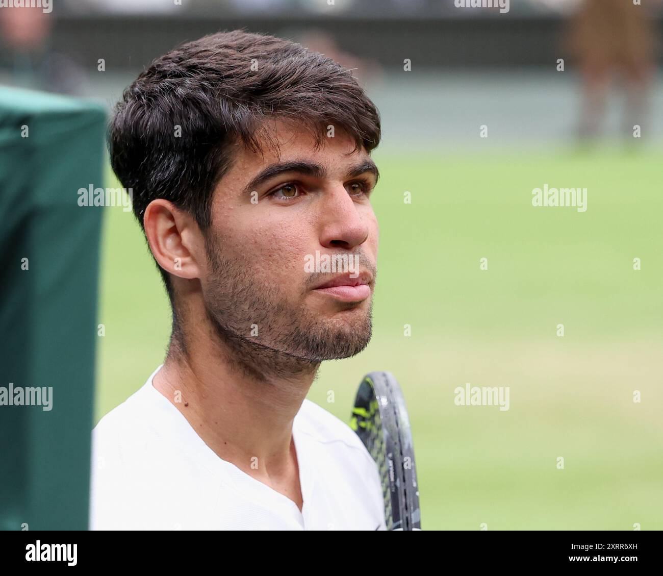 Spanish tennis player Carlos Alcaraz looking at his coach on the centre ...