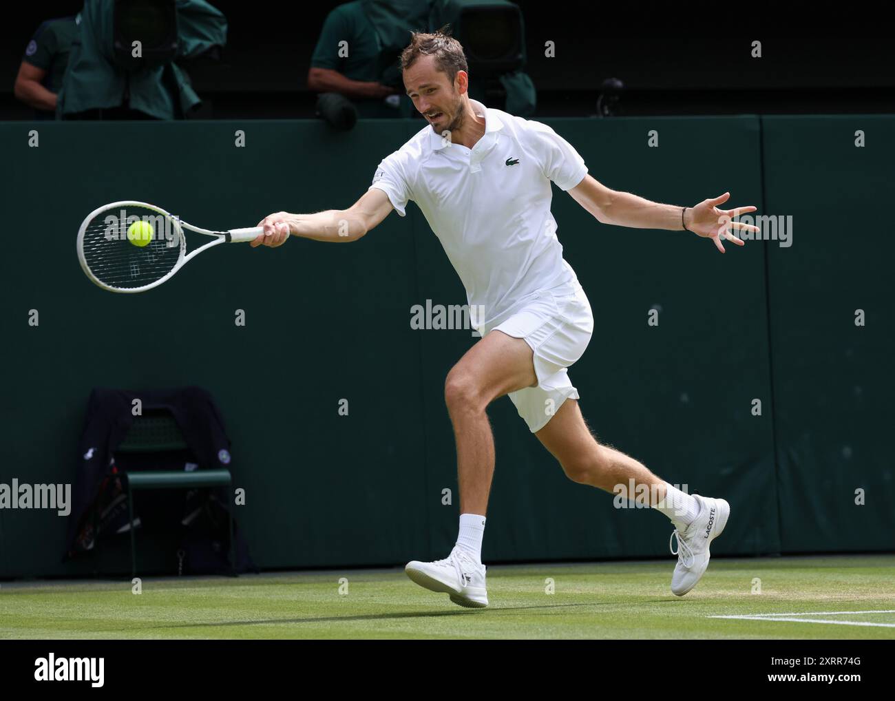 Russian tennis player Daniil Medvedev in action at the 2024 Wimbledon ...