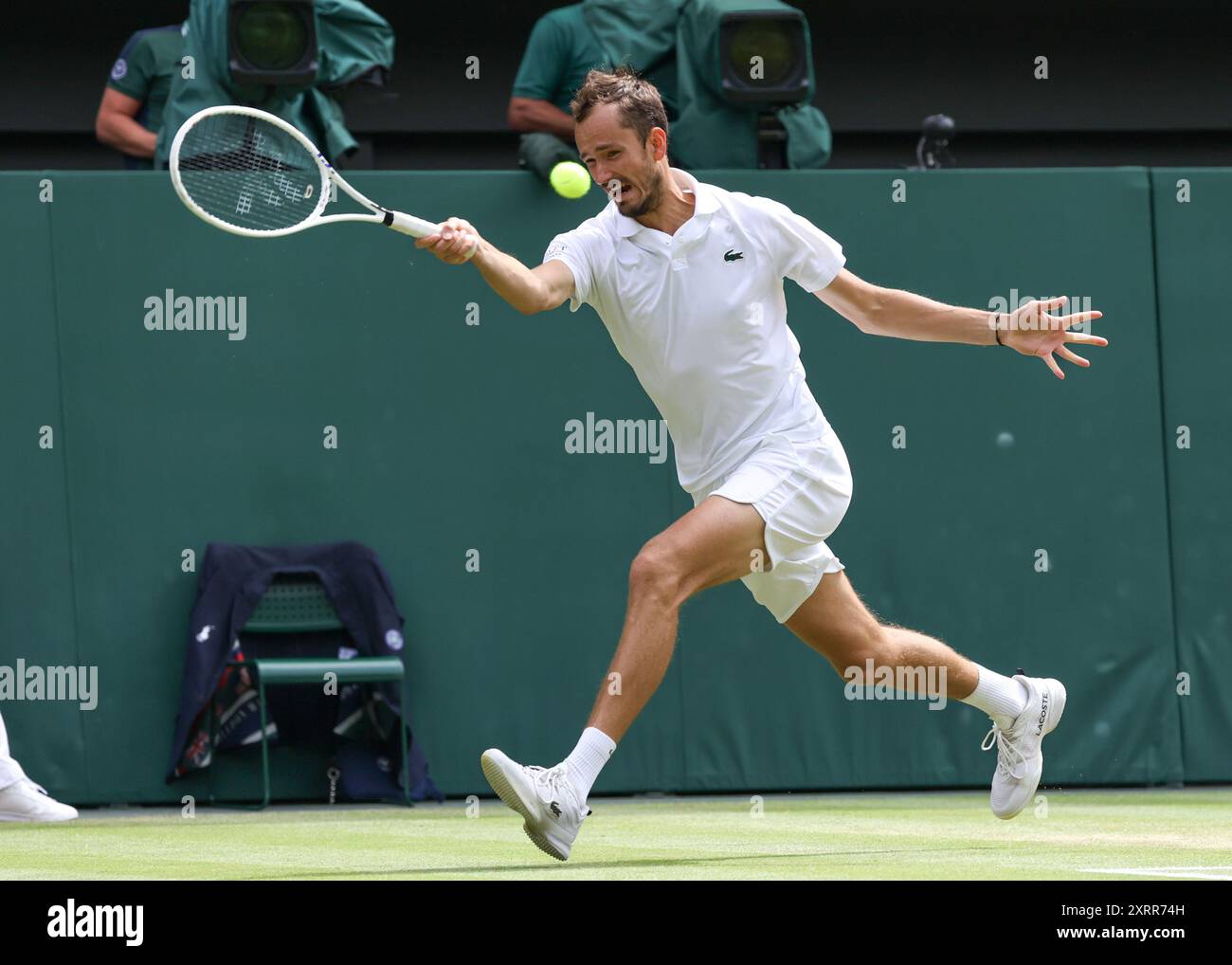 Russian tennis player Daniil Medvedev in action at the 2024 Wimbledon ...