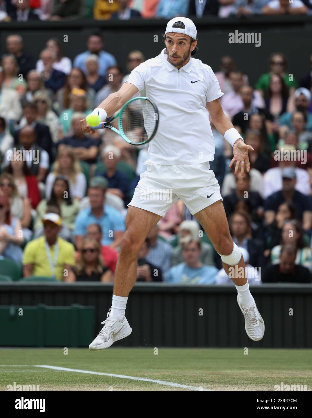 Italian tennis player Lorenzo Musetti in action at the 2024 Wimbledon ...