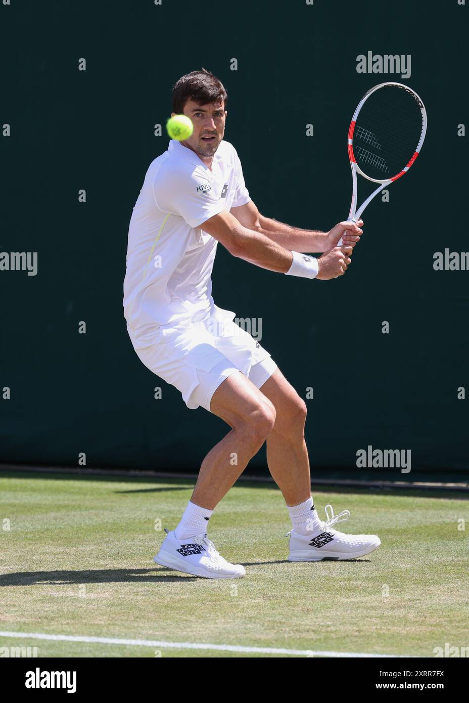 Austrian tennis player Sebastian Ofner in action at the 2024 Wimbledon ...
