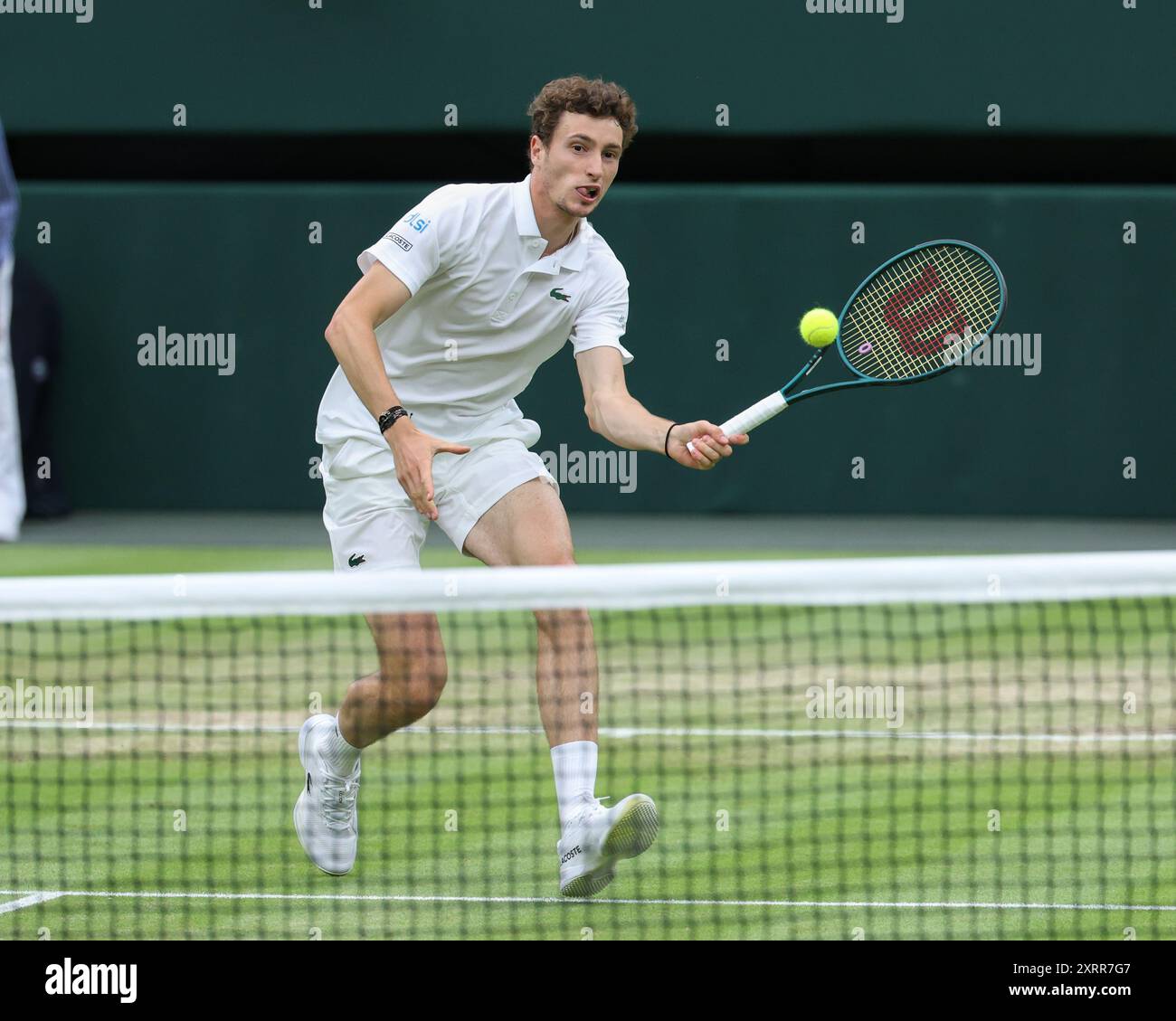 French tennis player Ugo Humbert in action at the 2024 Wimbledon ...
