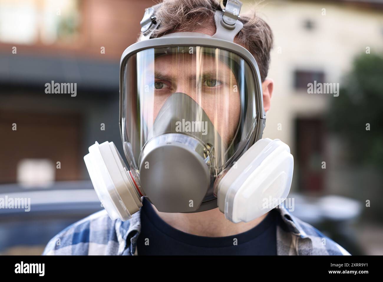 Man in respirator mask outdoors. Safety equipment Stock Photo - Alamy