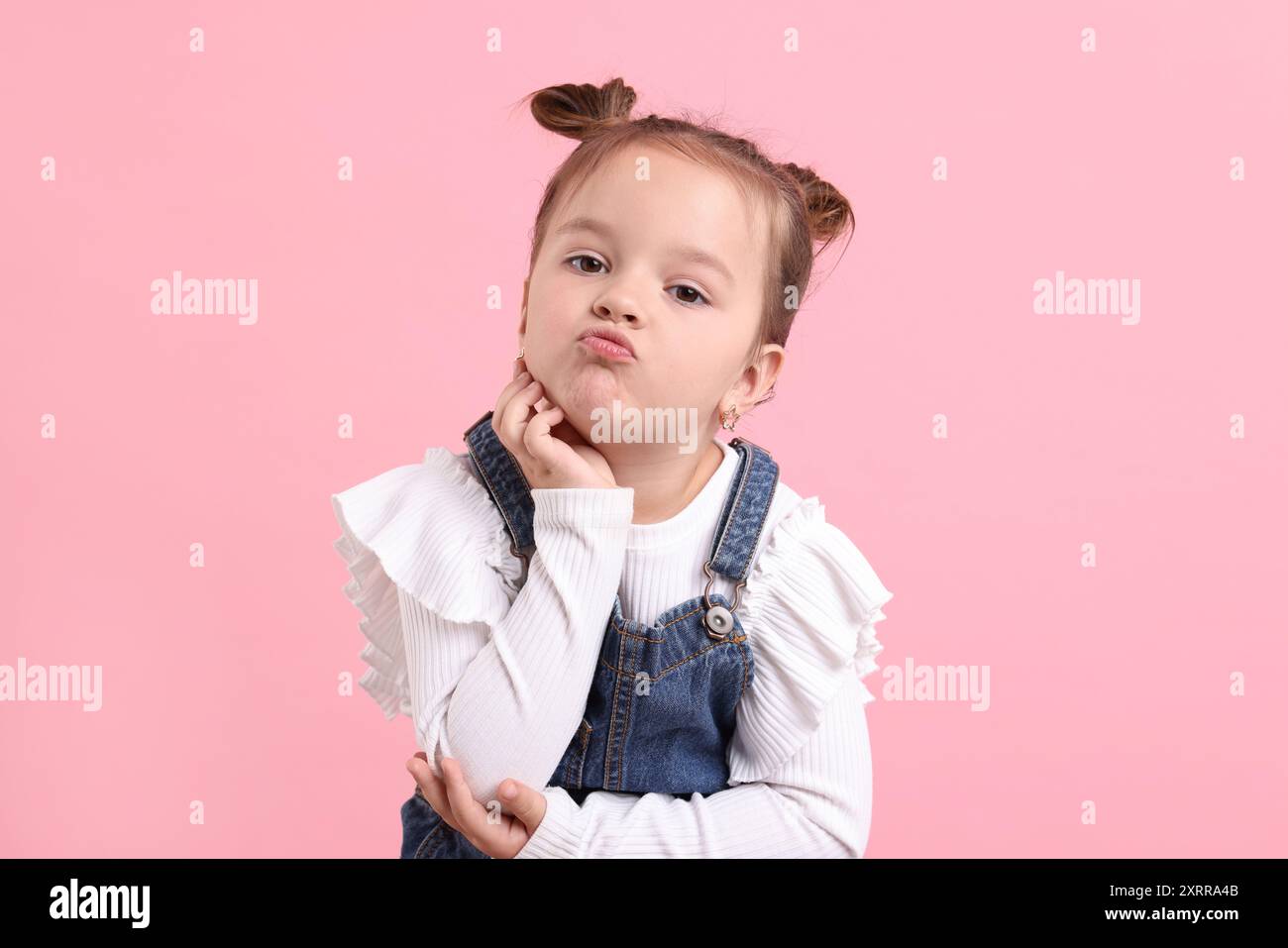 Portrait of cute little girl on pink background Stock Photo - Alamy