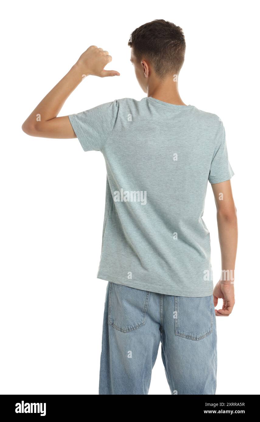 Teenage boy wearing light grey t-shirt on white background, back view ...