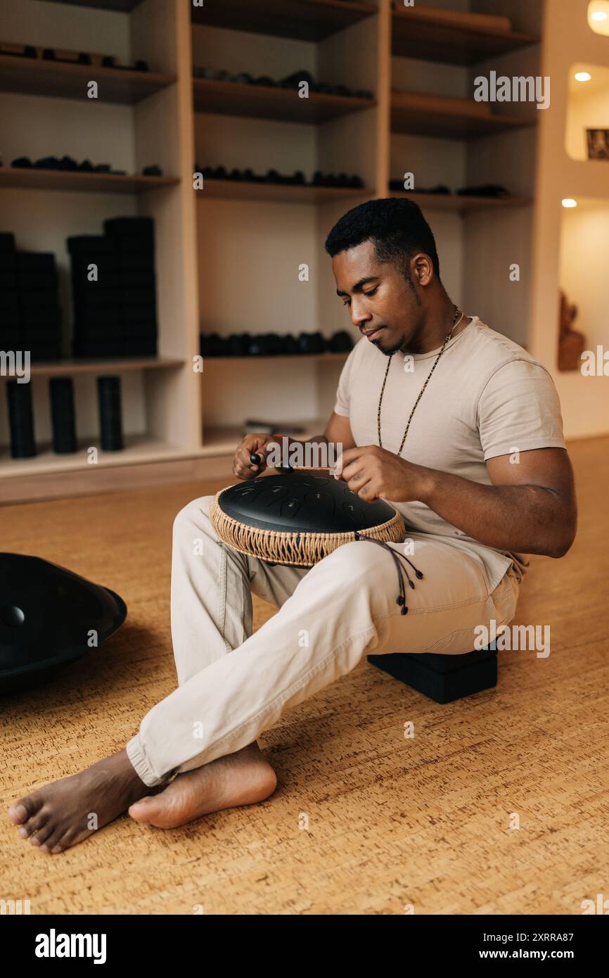 Musician playing hang drum in hi-res stock photography and images - Alamy