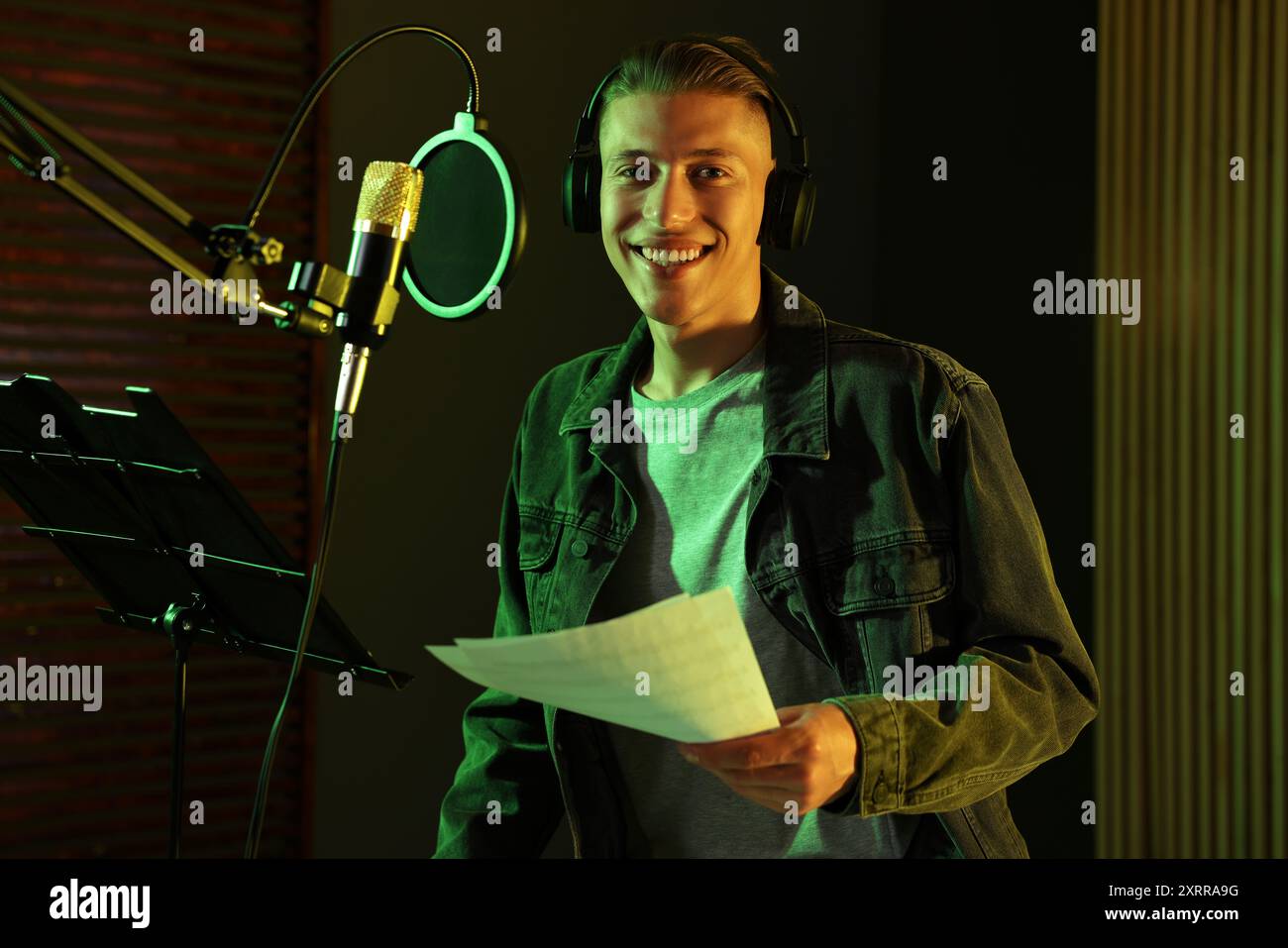 Young male singer recording track hi-res stock photography and images ...