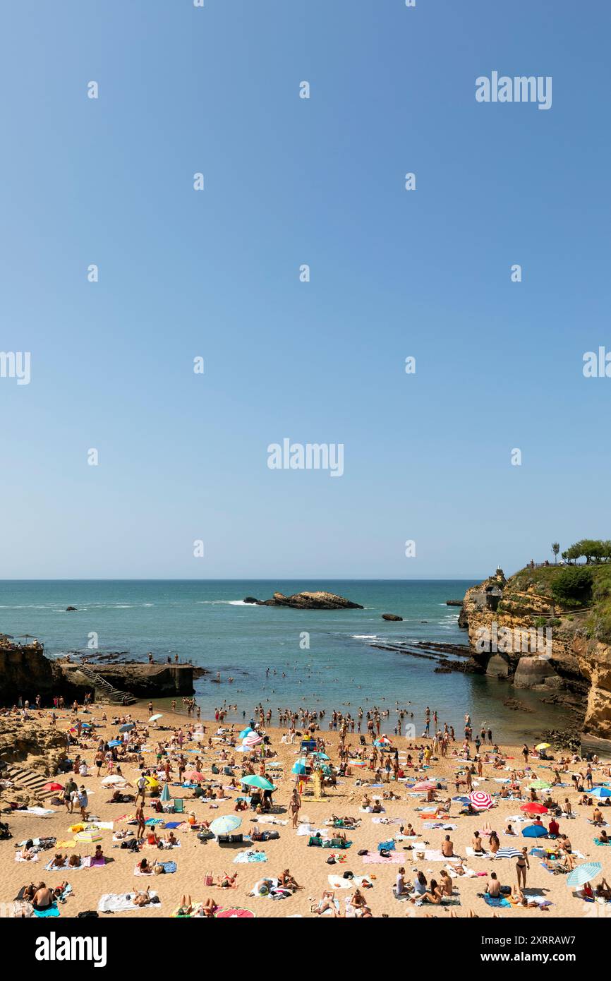 People on the beach at Plage du Port Vieux in Biarritz, France, during ...