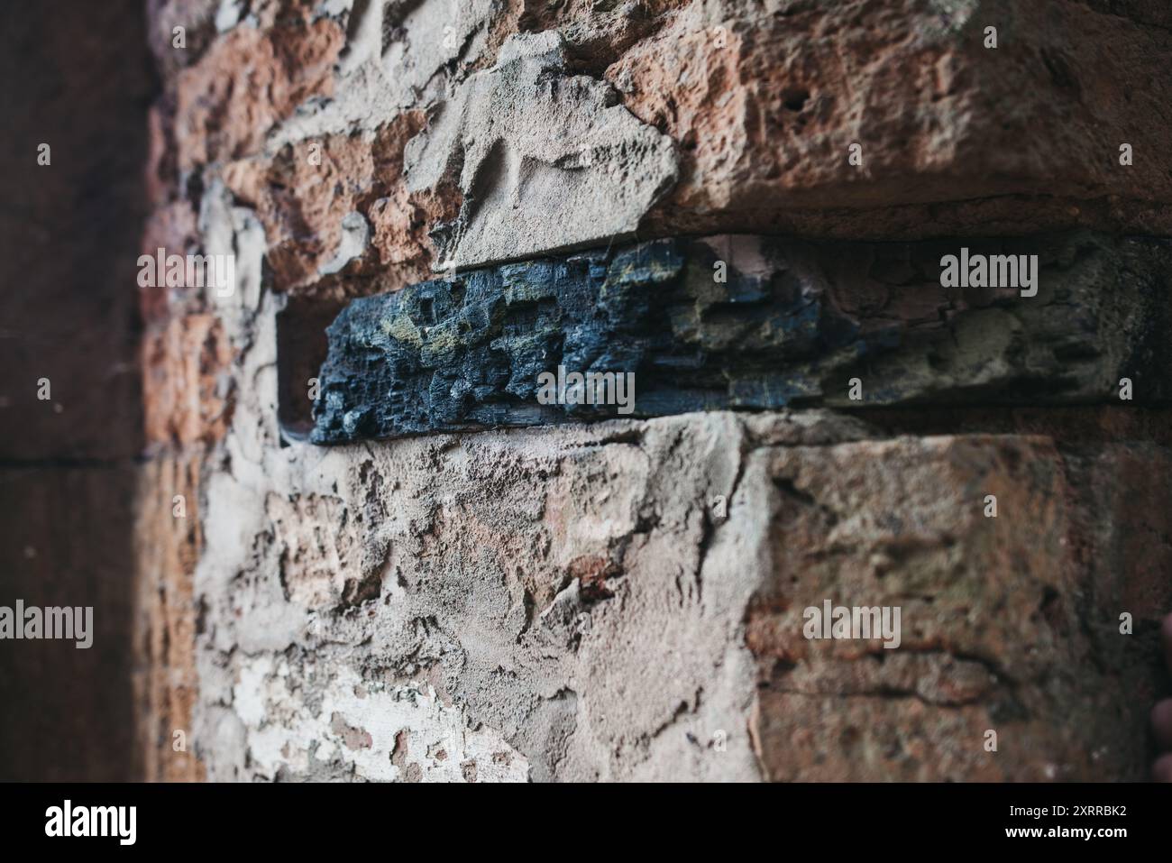 Charred wood inside historic house wall from internal fire damage Stock ...