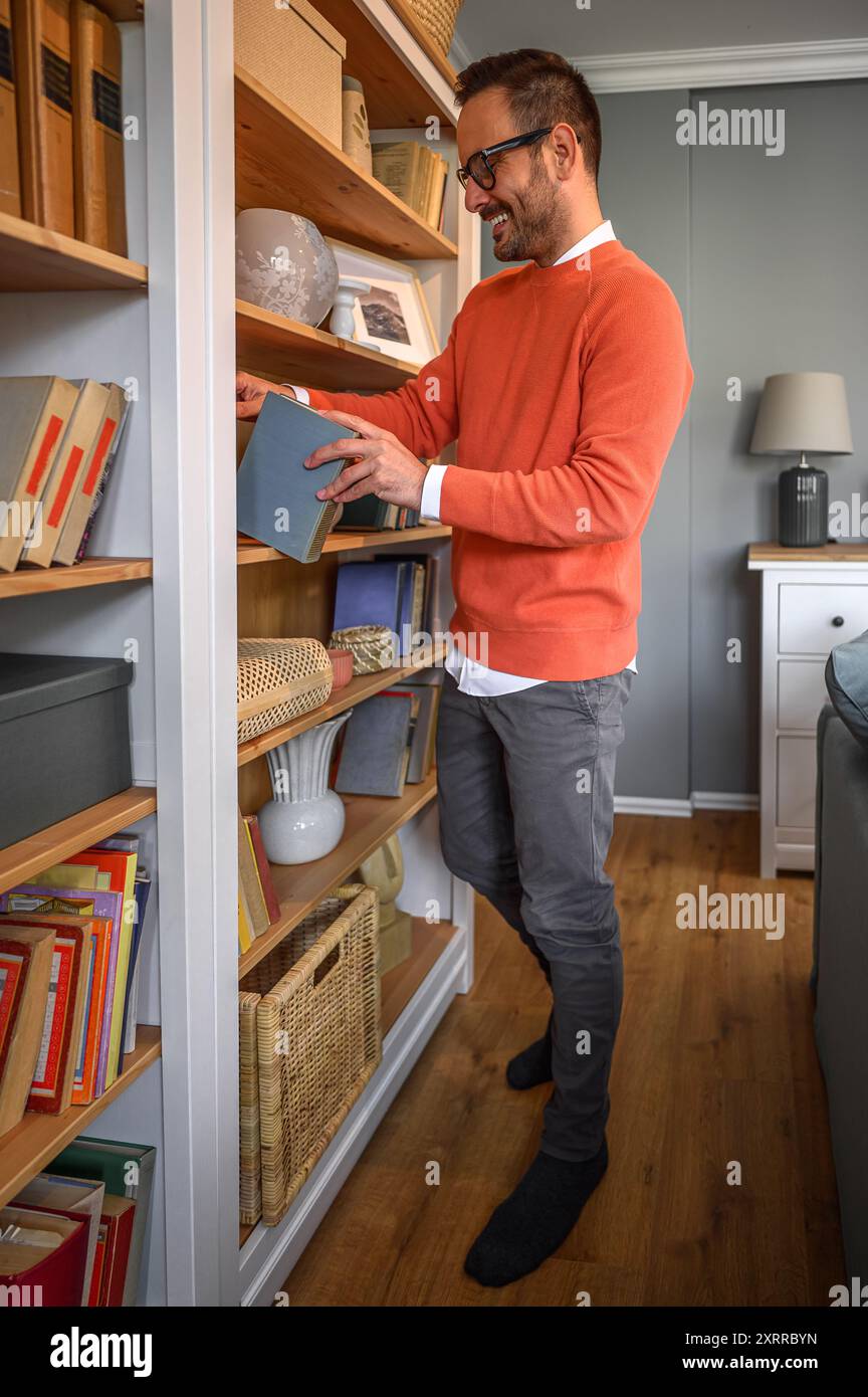Person choosing book from library hi-res stock photography and images ...