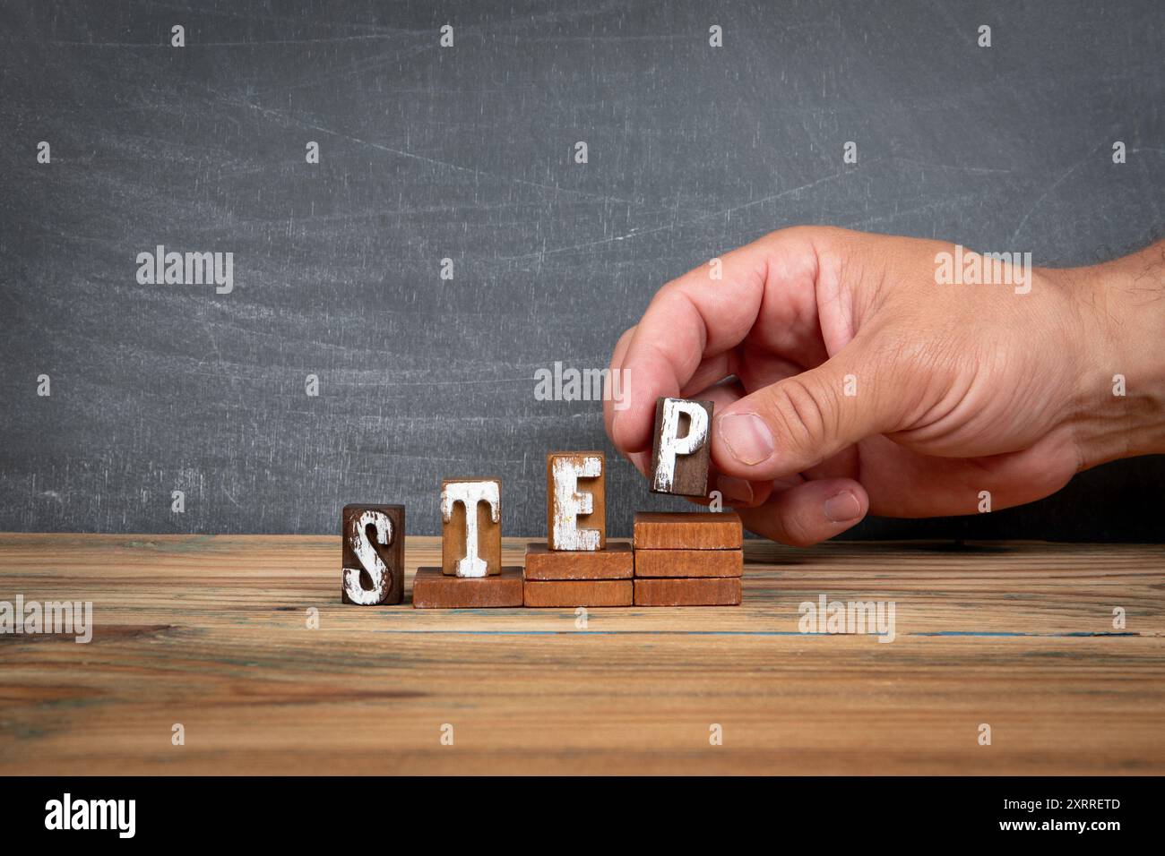 STEP. Wooden letters, alphabet blocks on steps. development and growth ...