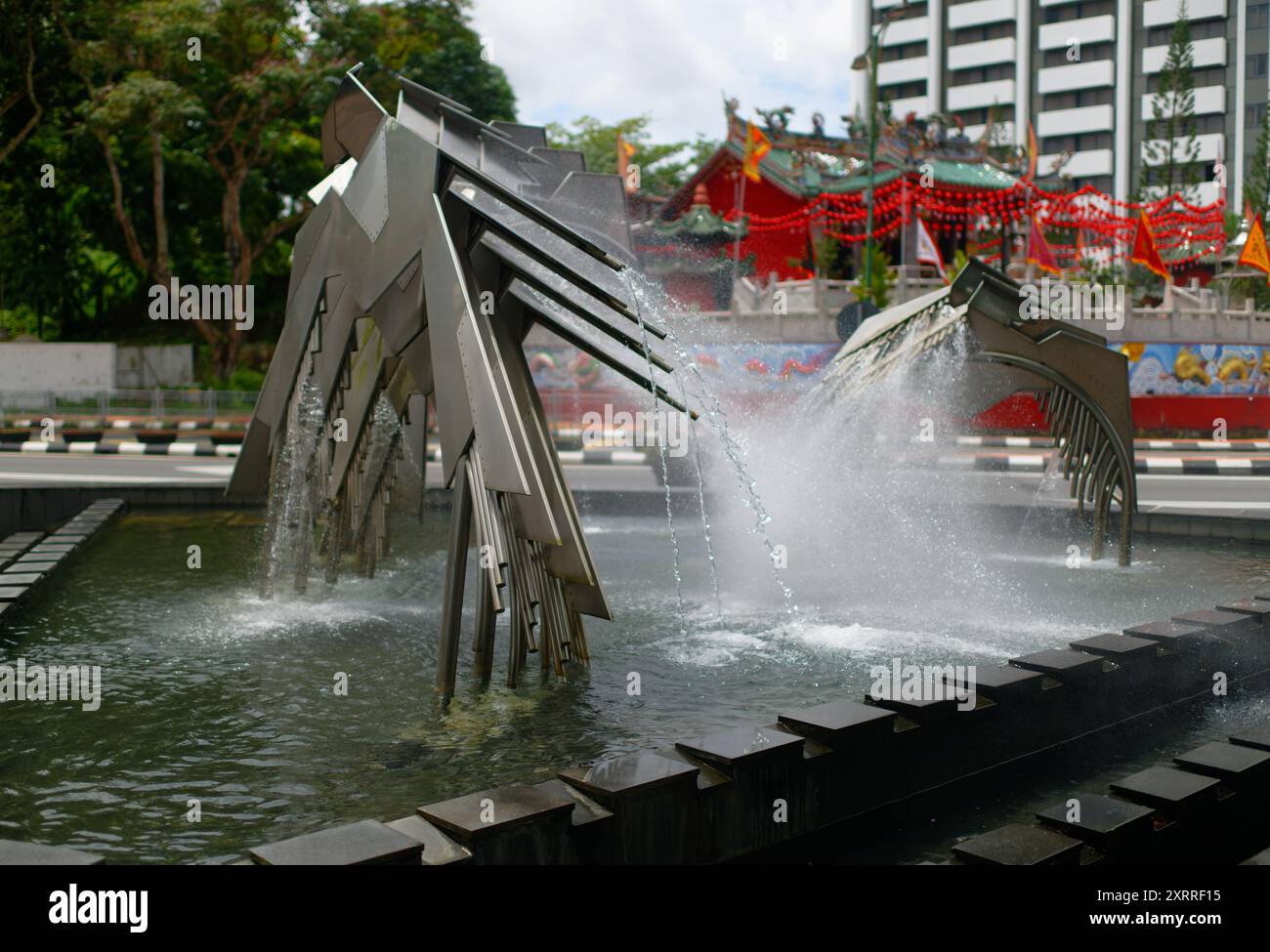 The hornbill fountain on Kuching riverside, with slow shutter to blur ...