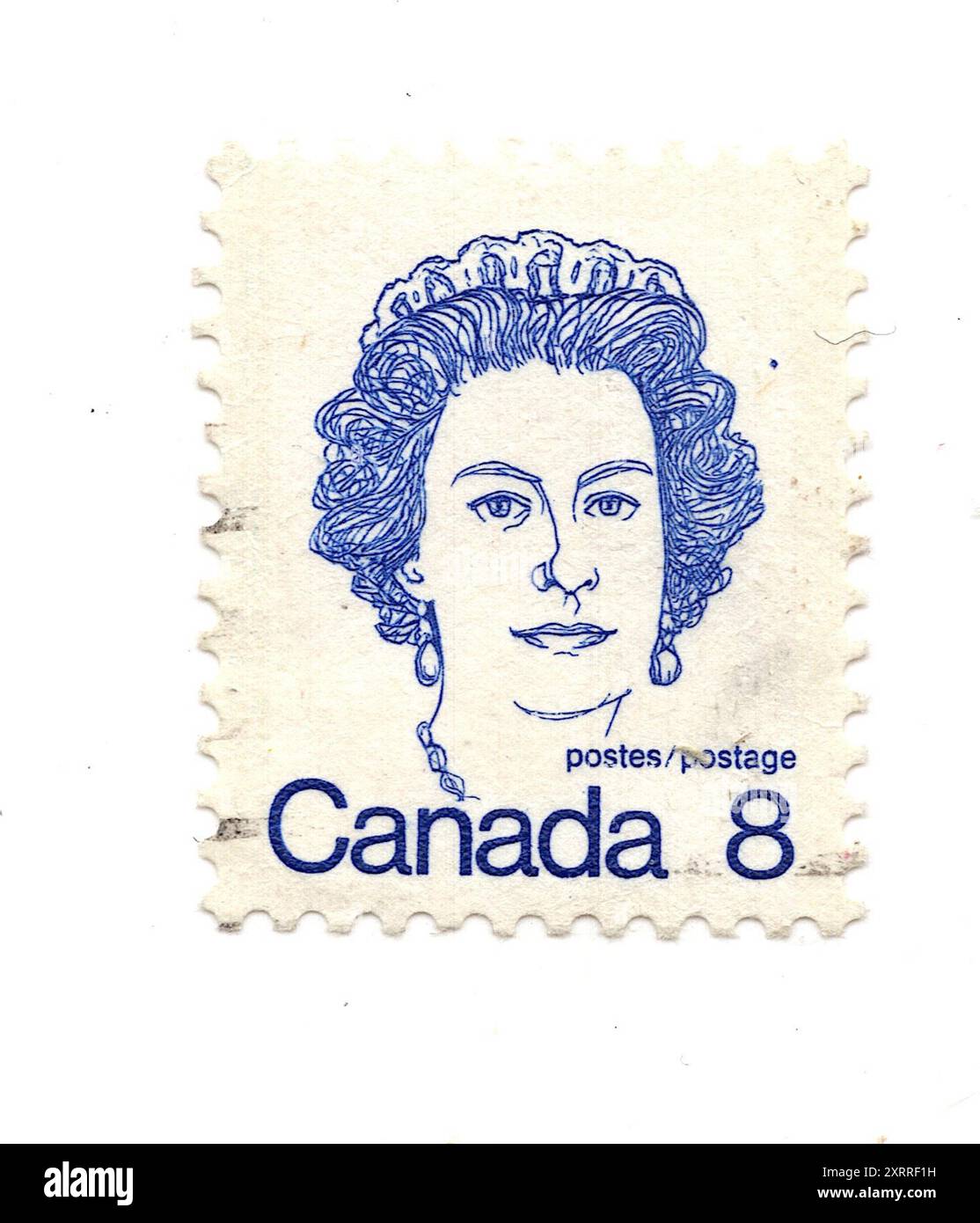 A vintage Queen Elizabeth II postage stamp from Canada on a white ...