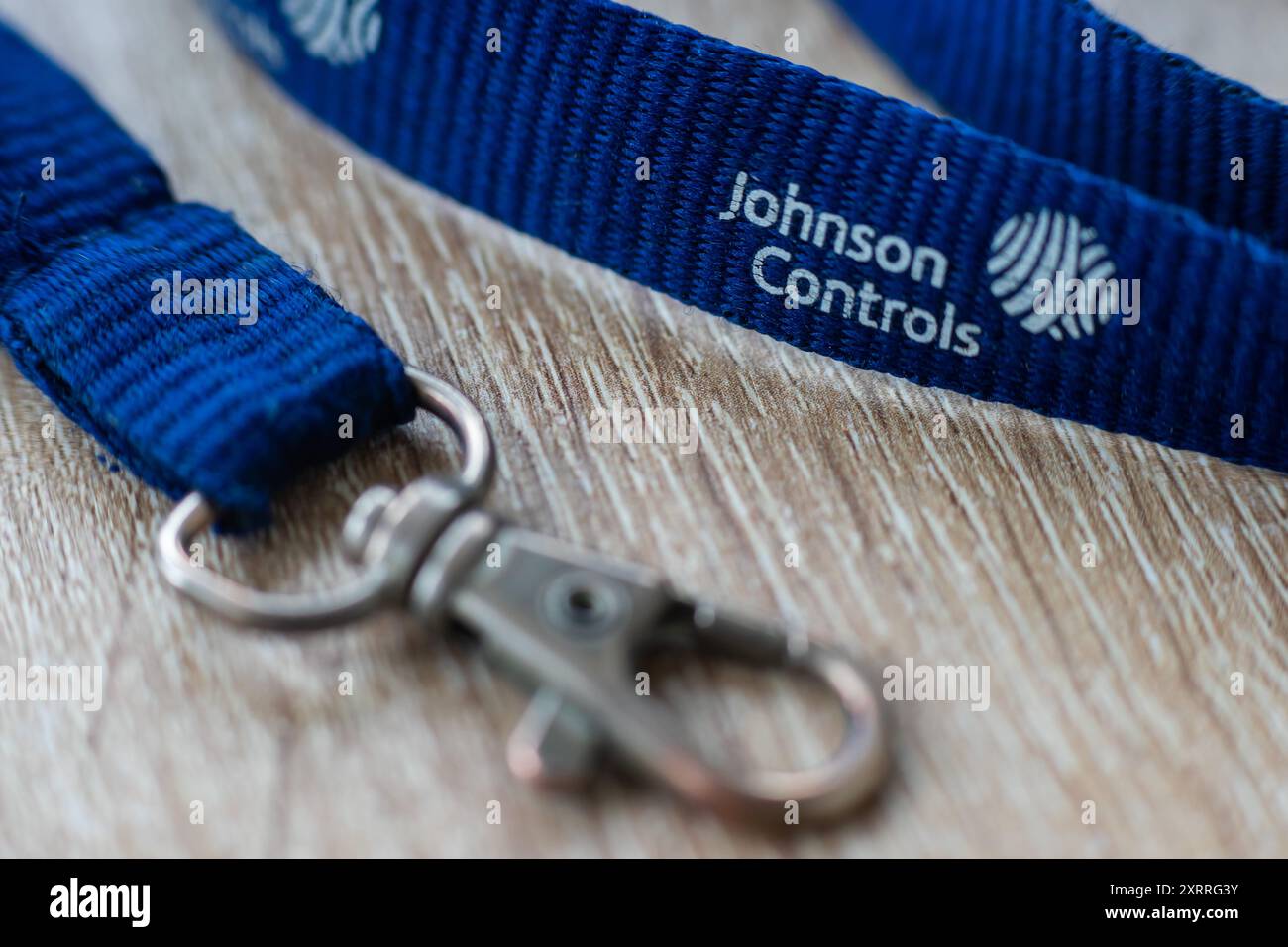 Timisoara, Romania - March 08, 2020: Close-up on a badge lanyard, focus on the Johnson Controls ...