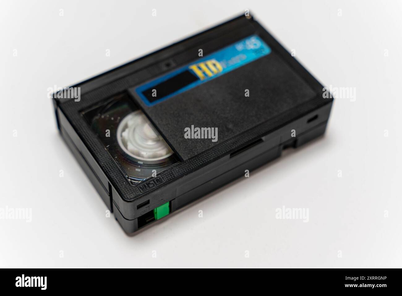 Vintage VHS film cassette with a blue sticker on a white background ...