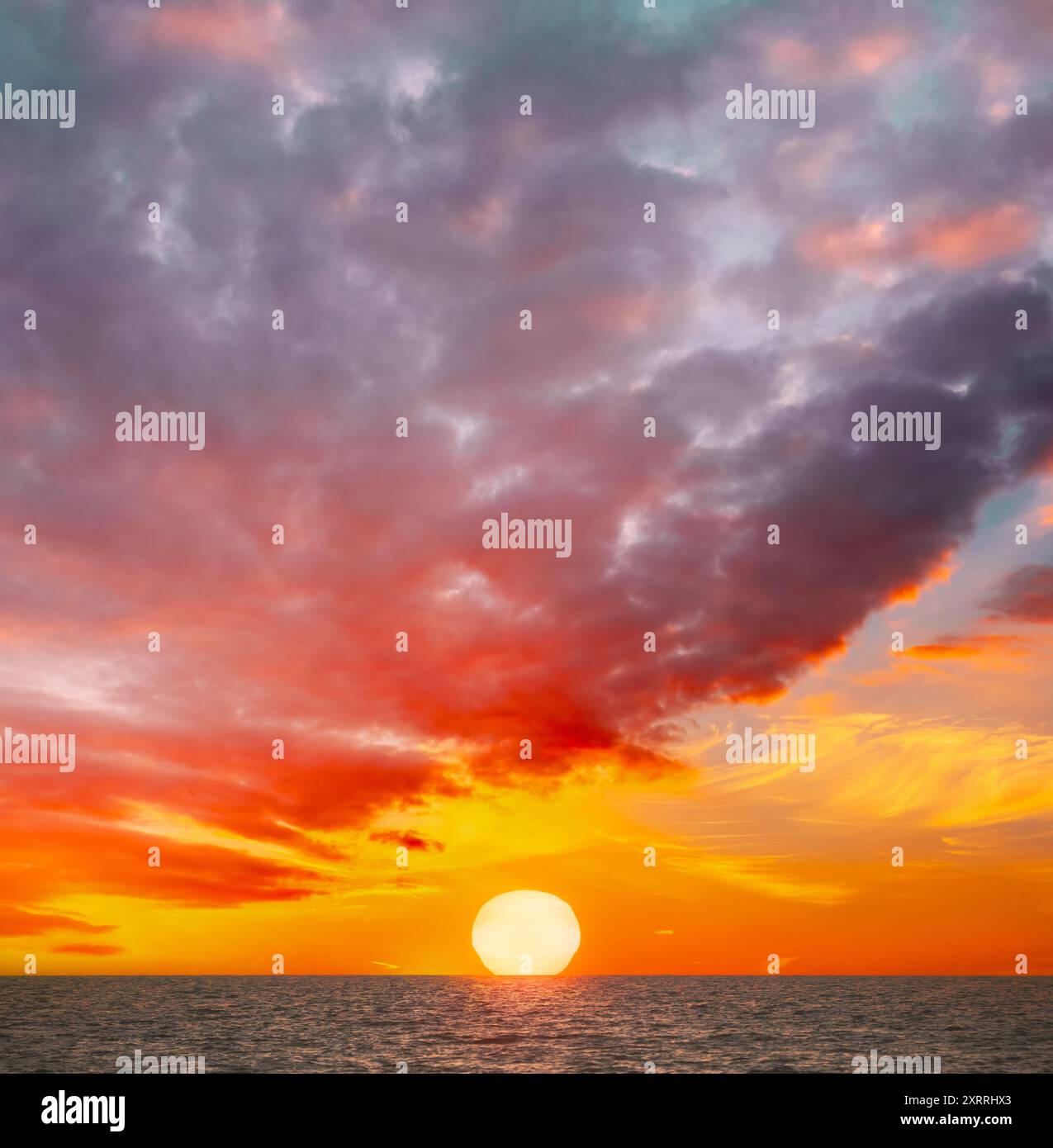 Natural Color Sunset Sunrise Sky Over Sea. Seascape With Shining ...