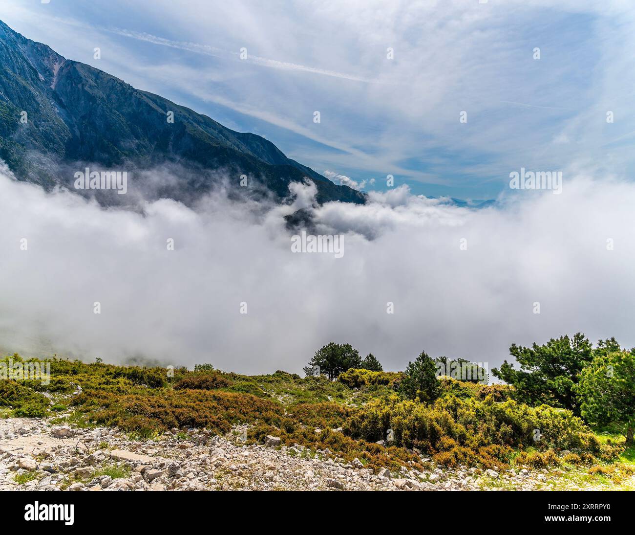 A view down over clouds below in the Llogara National Park, Albania in ...