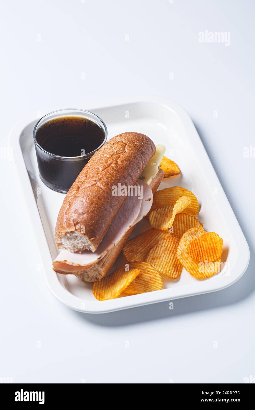 Meat and cheese sandwich with chips and drink. Fast food, junk, Street ...