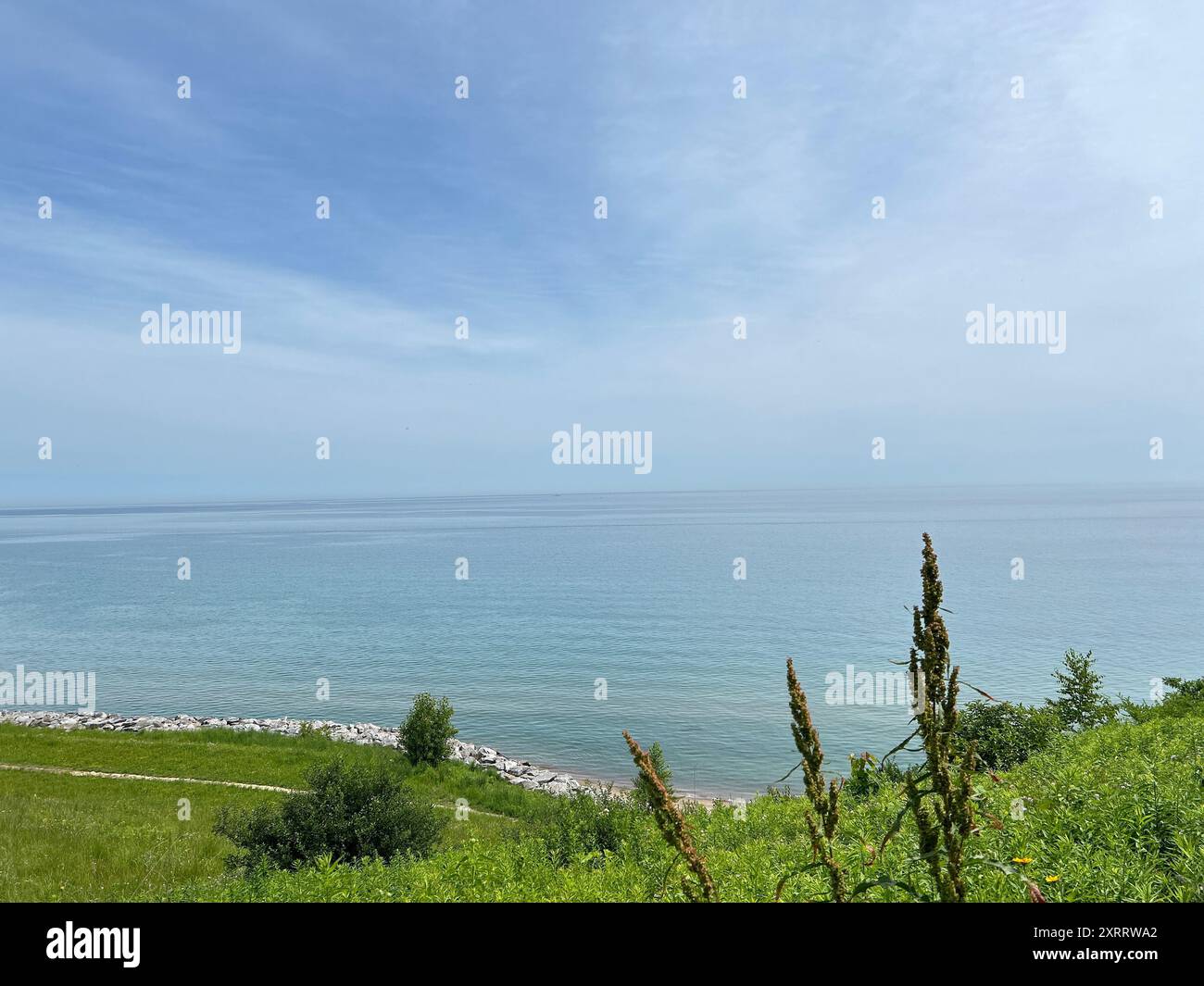 A scenic view of Lake Michigan with greenery on the South Milwaukee ...