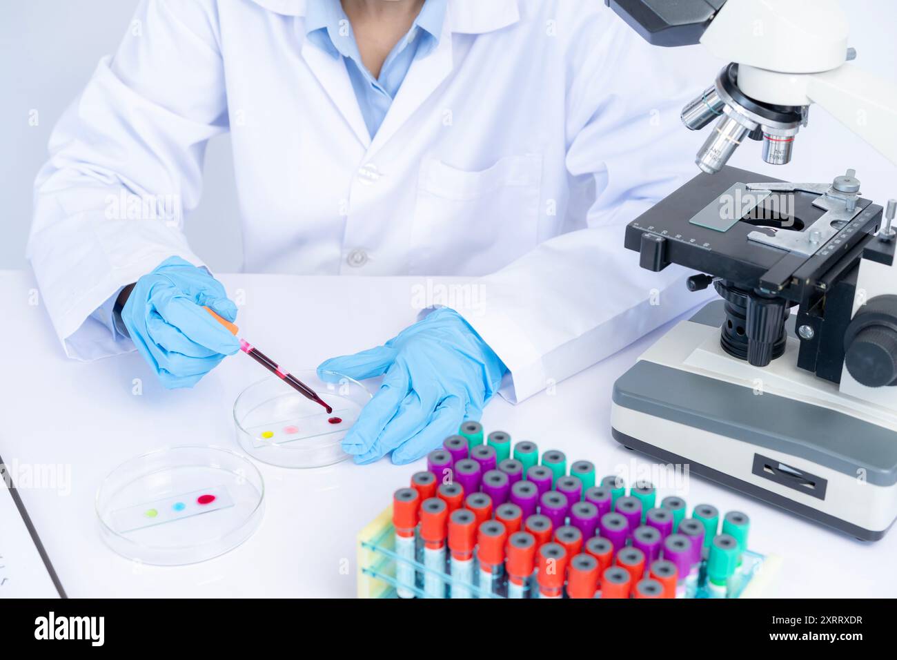 Laboratory technician filling sample hi-res stock photography and ...