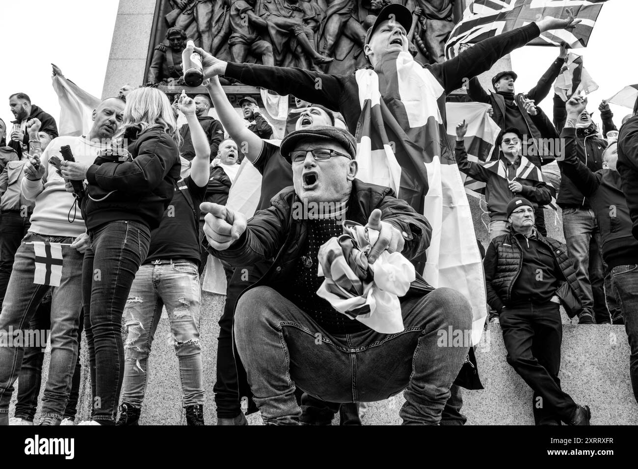 A Group of English People Singing In Trafalgar Square During St George ...