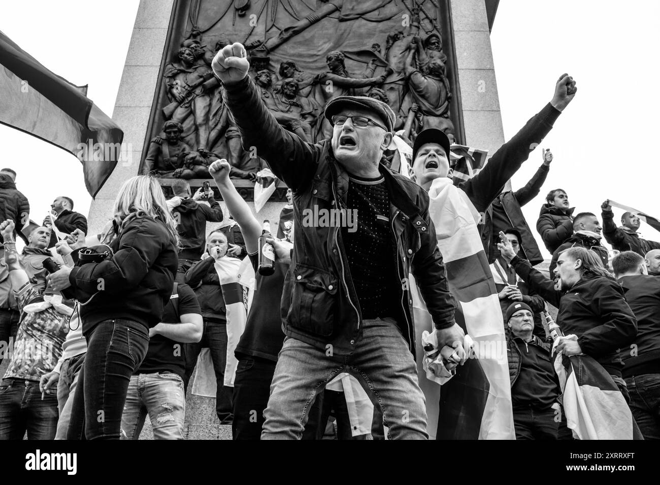 A Group of English People Singing In Trafalgar Square During St George ...