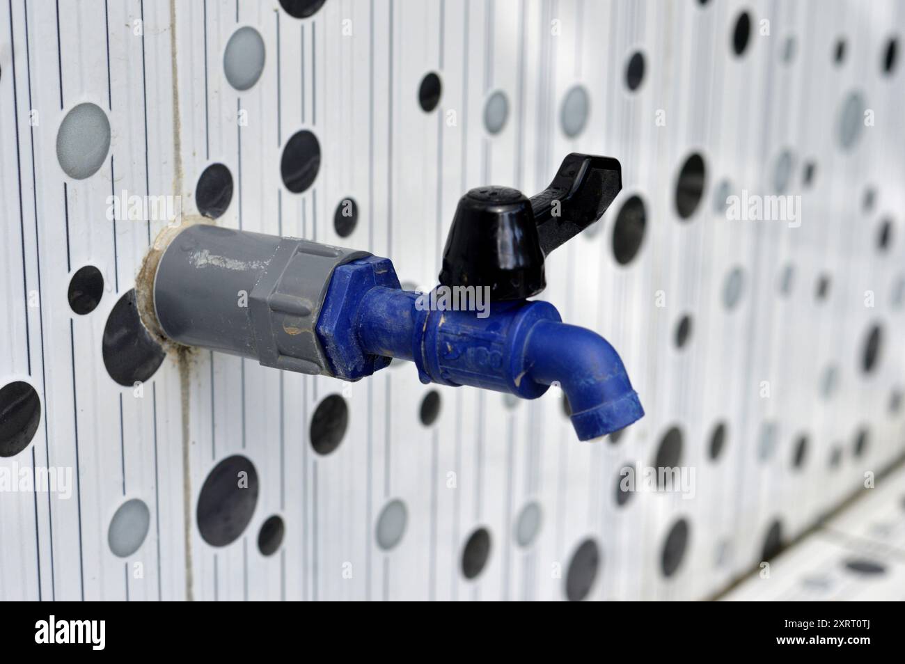blue water tap on tiled wall Stock Photo - Alamy