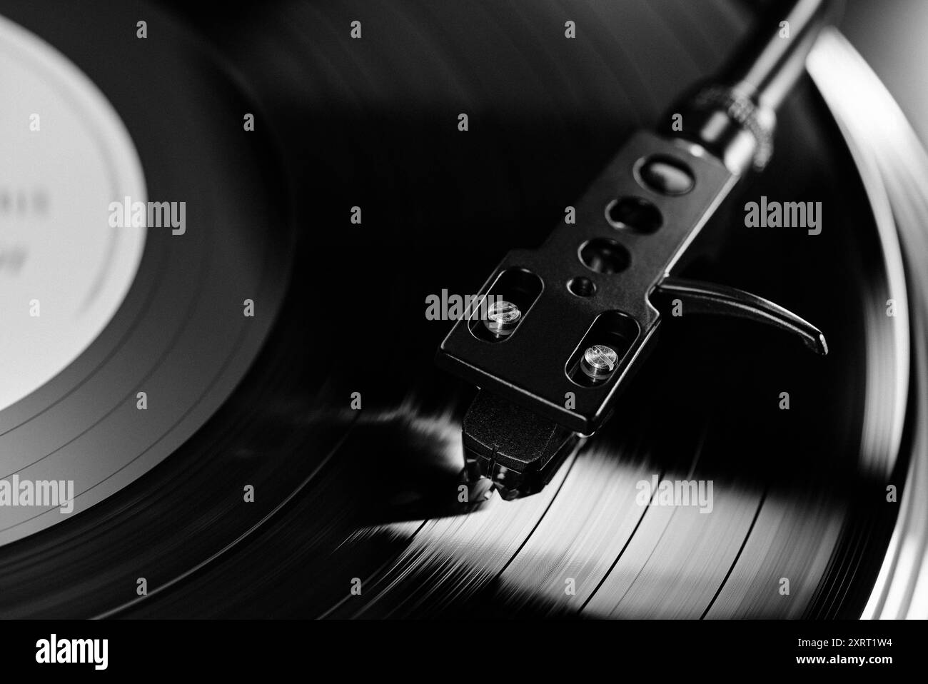 Segments of vinyl record spinning, macro view. Playing music, macro LP ...