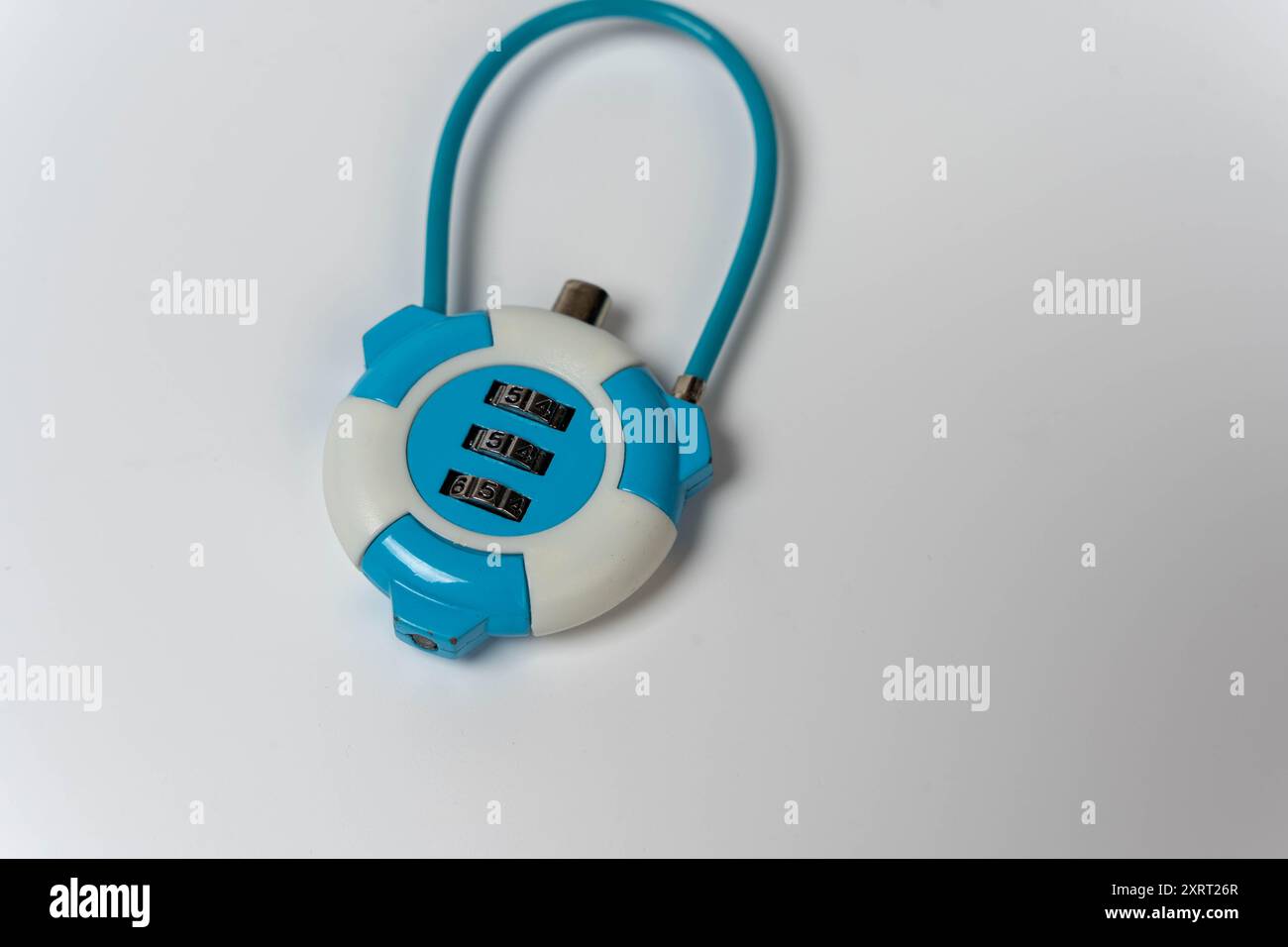 A blue combination lock with a white dial and a blue cable Stock Photo ...