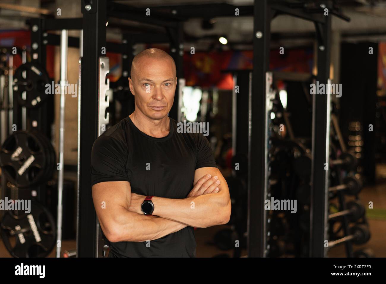 Bald handsome sportsman wearing black hi-res stock photography and ...
