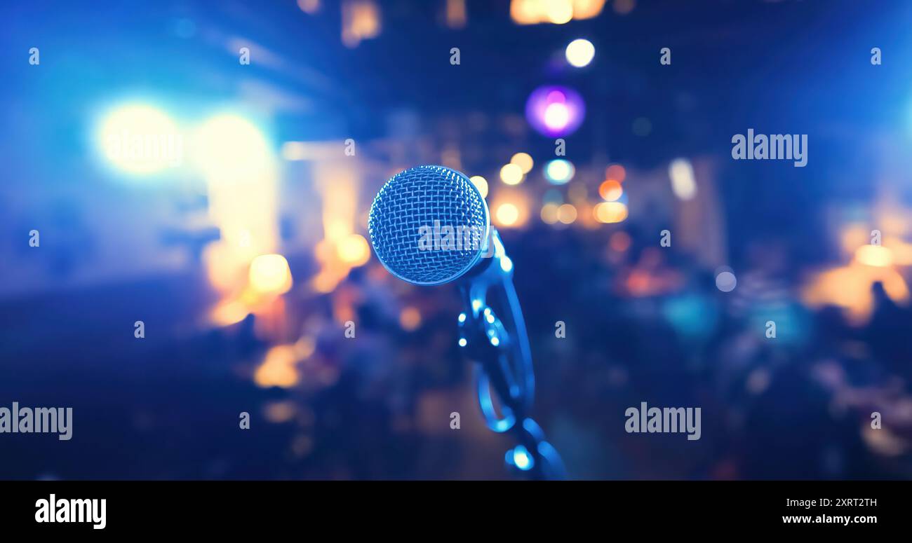 Public performance on stage Microphone on stage against a background of ...