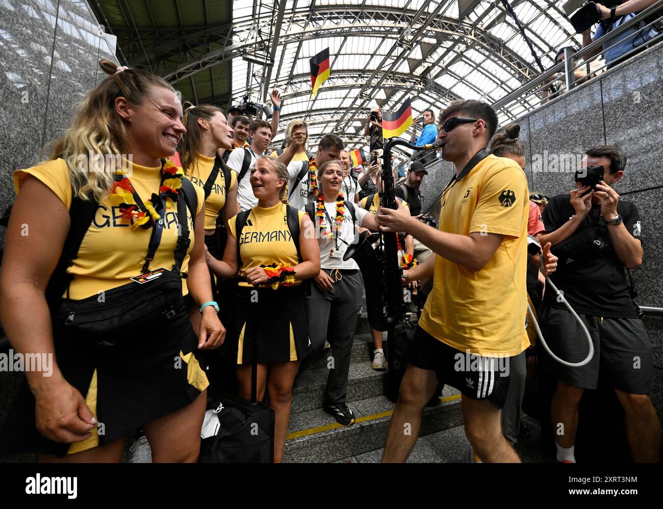 Cologne, Germany. 12th Aug, 2024. André Schnura (r), saxophonist, plays ...