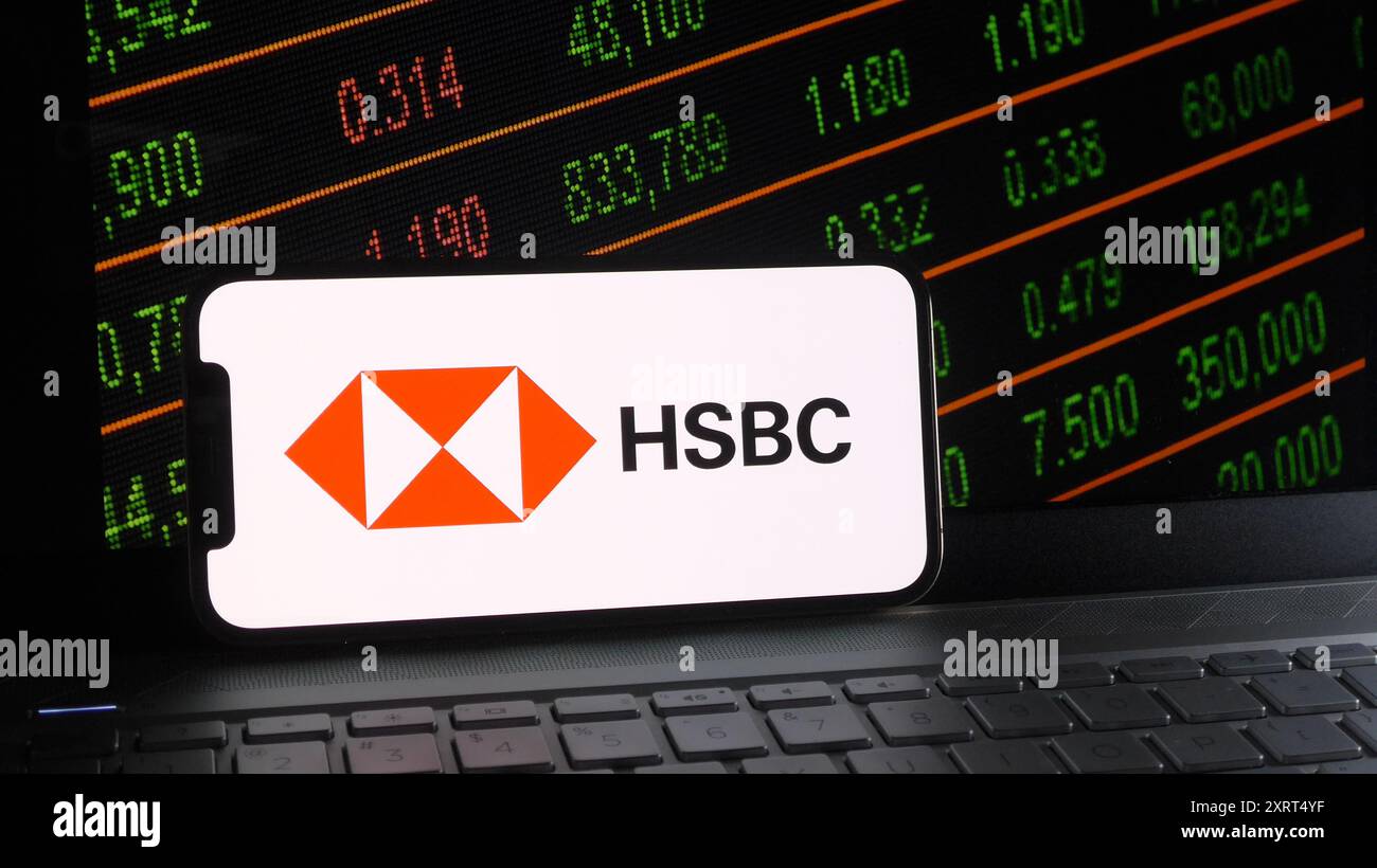 In this photo illustration, HSBC logo is displayed on a smartphone with ...