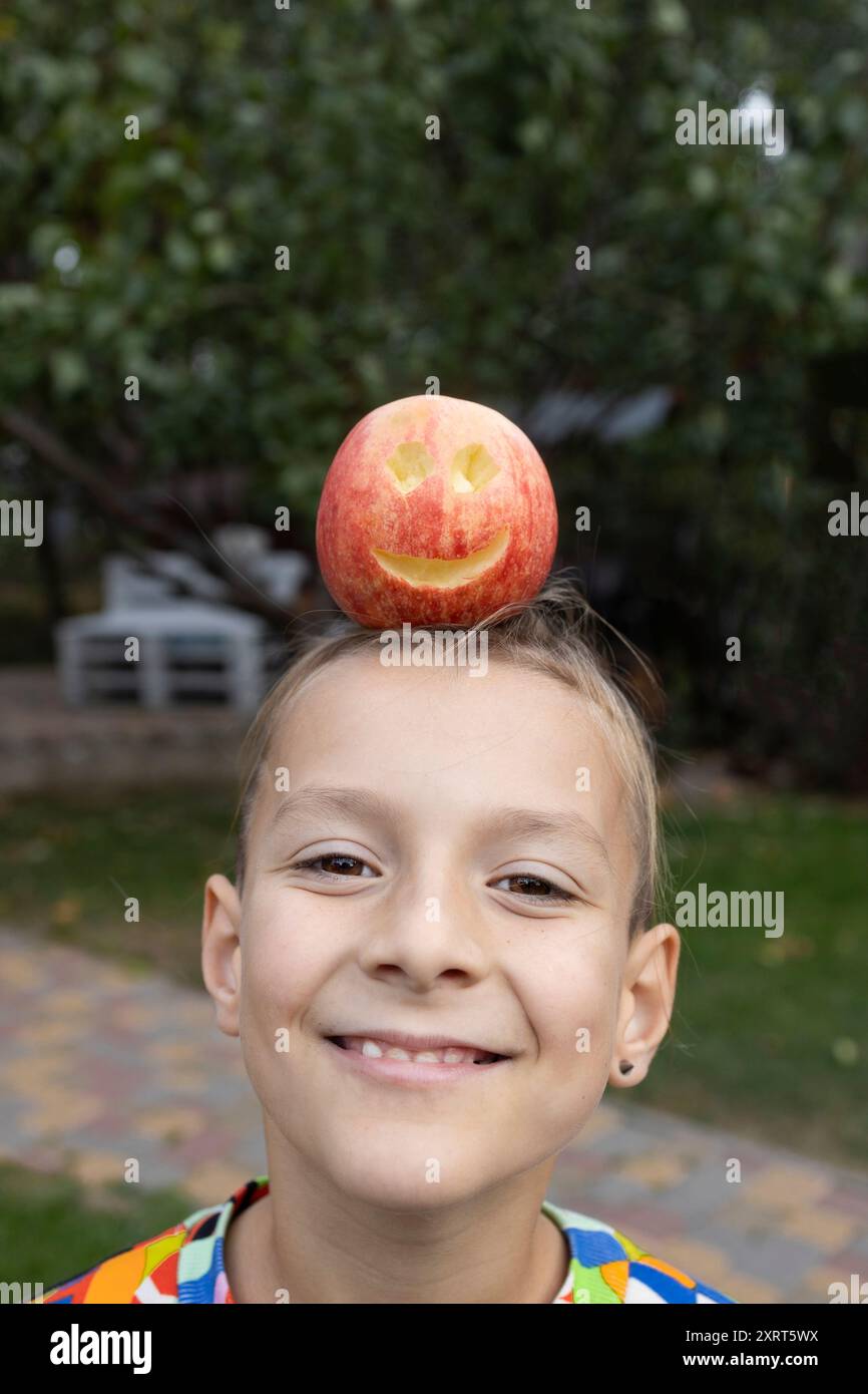 Funny smiling kid eating apple hi-res stock photography and images - Alamy
