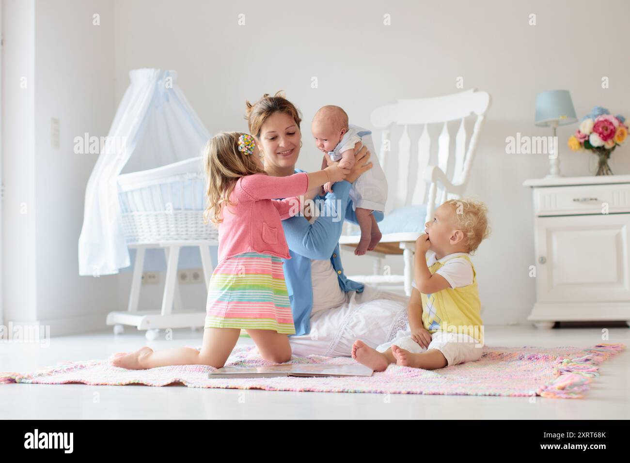 Big family with four kids in white bedroom. Parents and kids standing ...