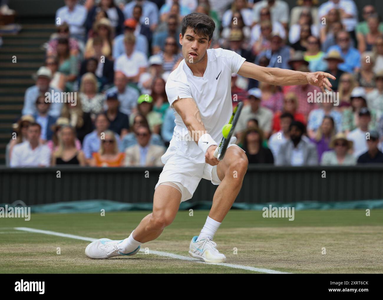 Spanish tennis player Carlos Alcaraz in action at the 2024 Wimbledon ...