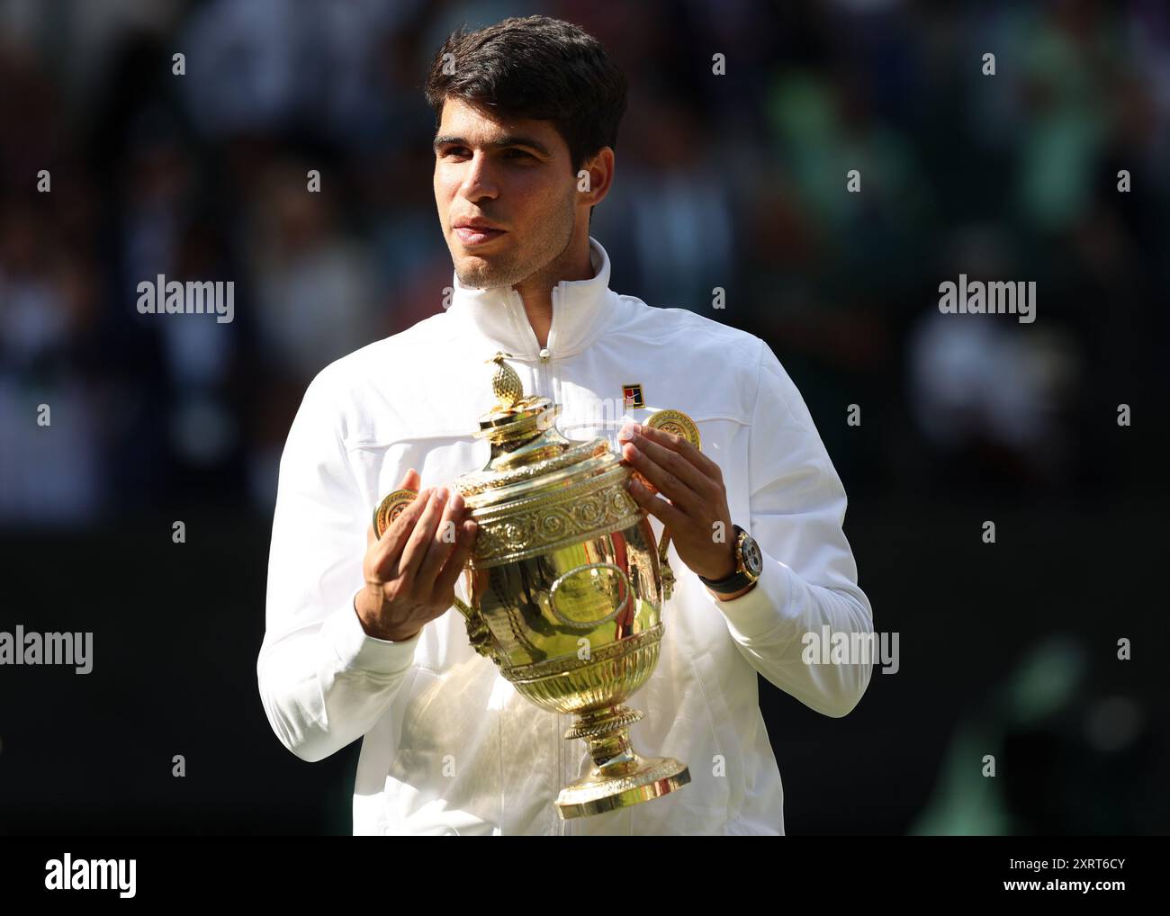 Spanish tennis player Carlos Alcaraz (ESP) holding the championship ...