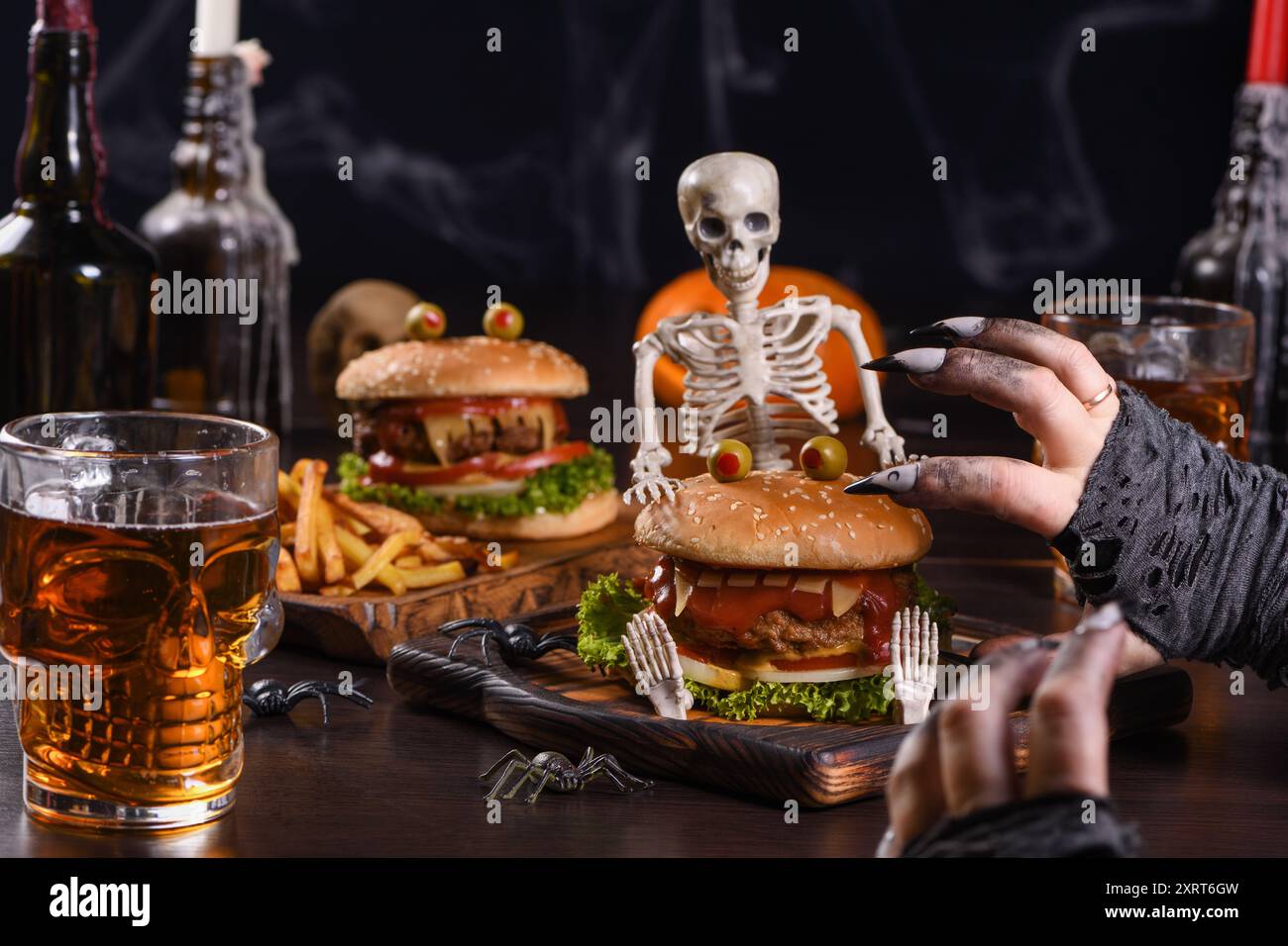 The witches hands want to grab the Monster Burger on the sitting ...