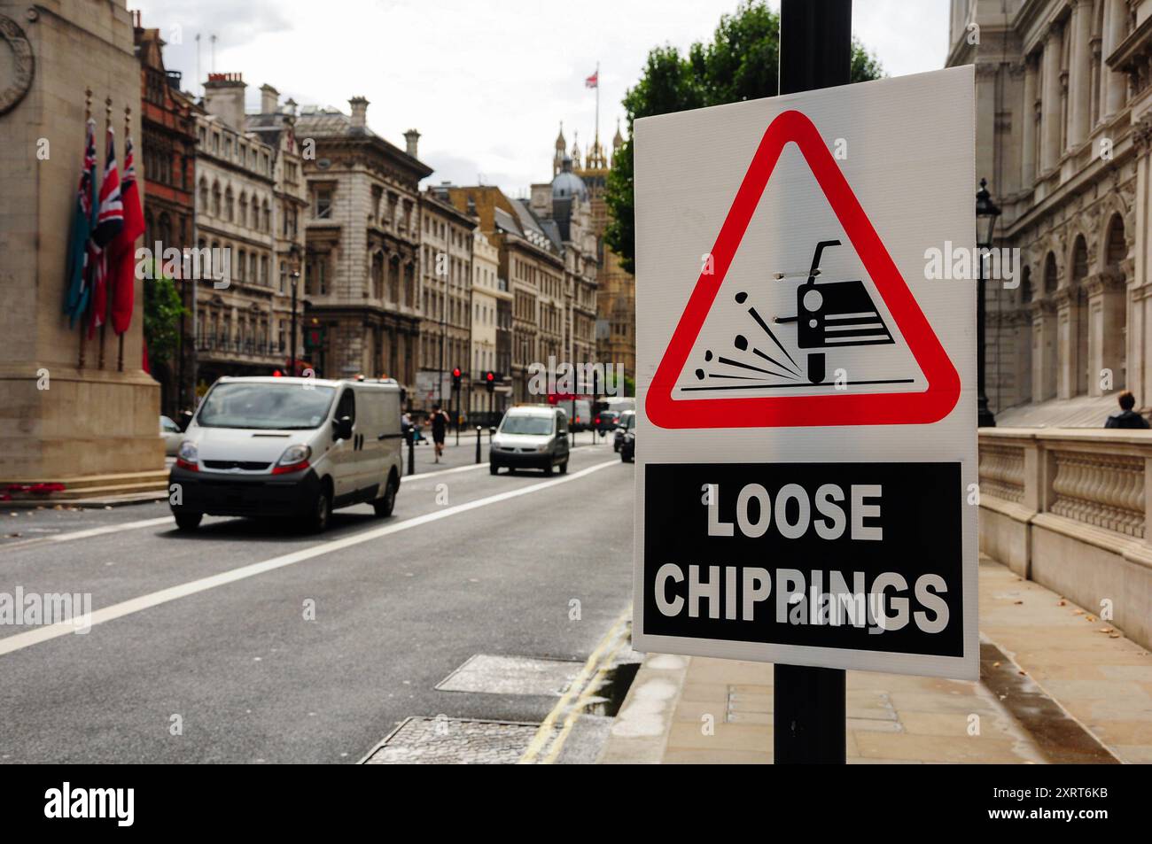 Loose Chippings Warning Sign on Busy London Street with Historic ...