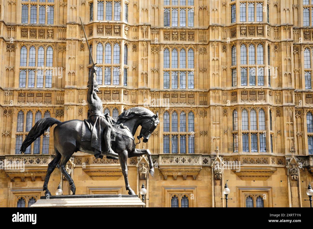 Historic equestrian statue in front of a grand architectural facade ...