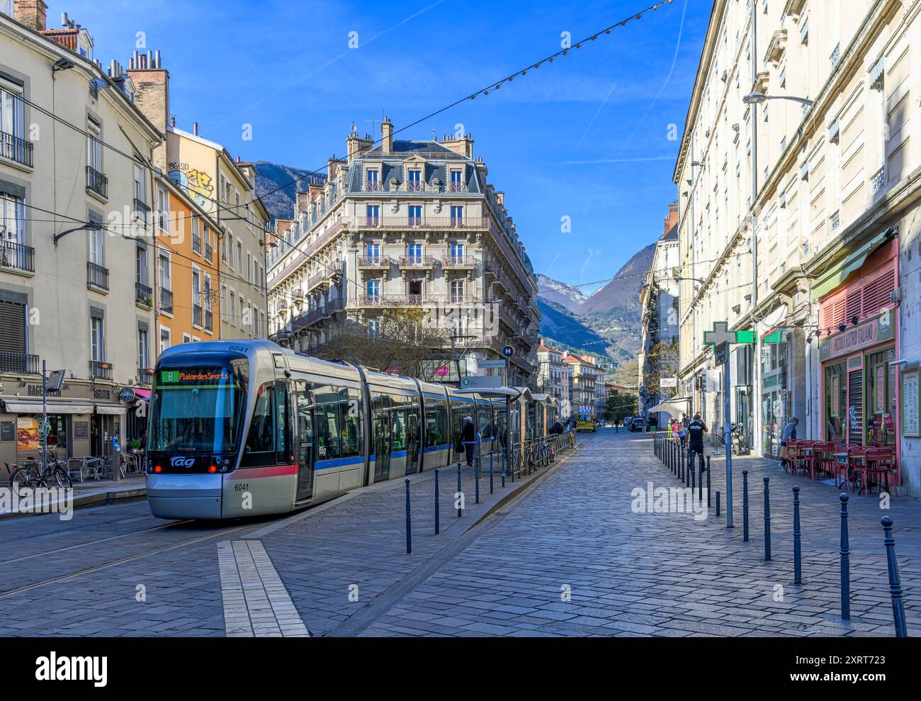 Grenoble city centre, South East France. With blue line B tram, stopped ...
