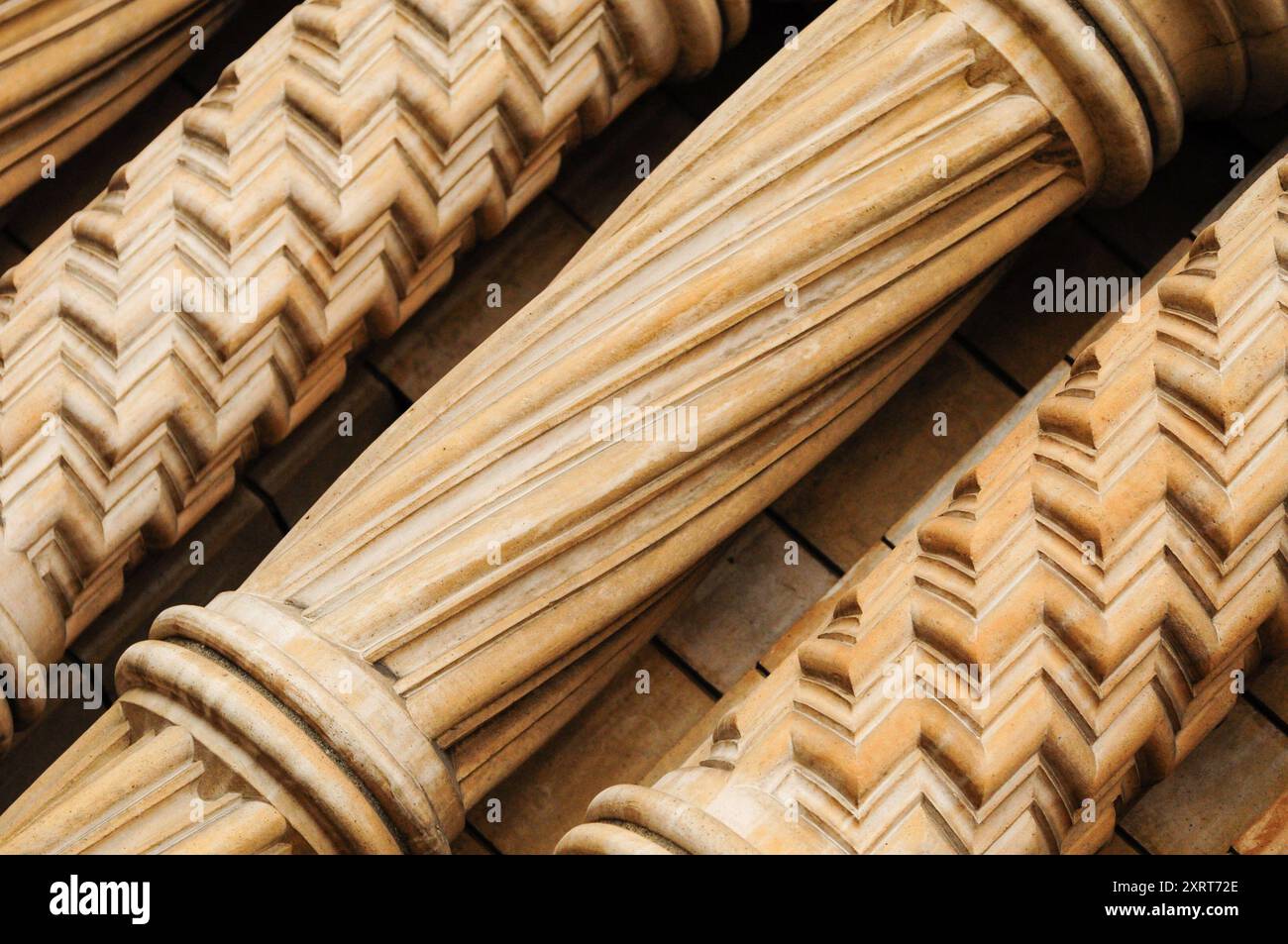 Carved stone columns with geometric patterns in historic architecture ...